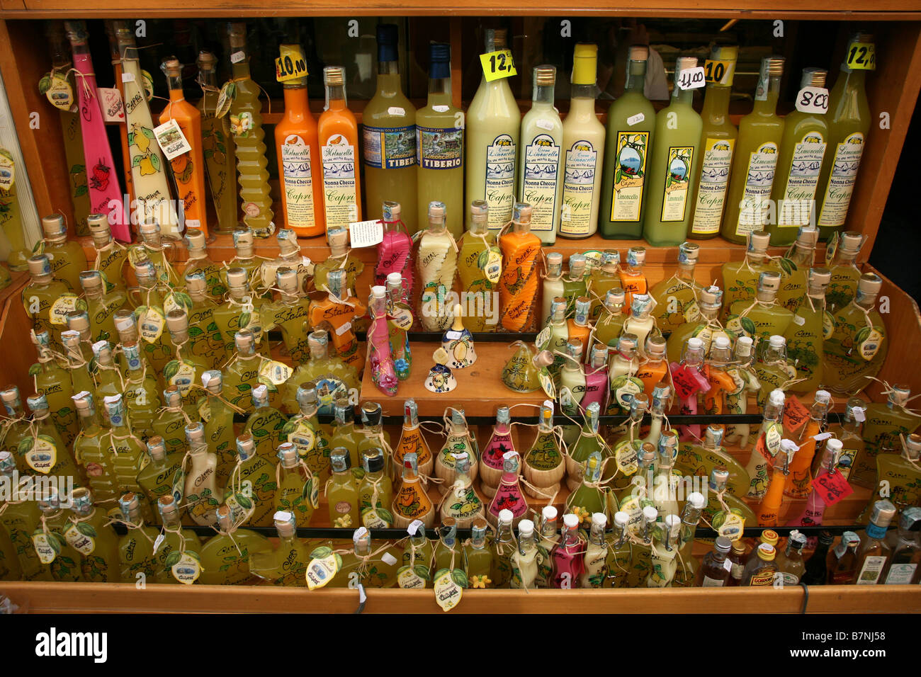 Bottles of Limoncello and Meloncello in a shop window in the town of ...