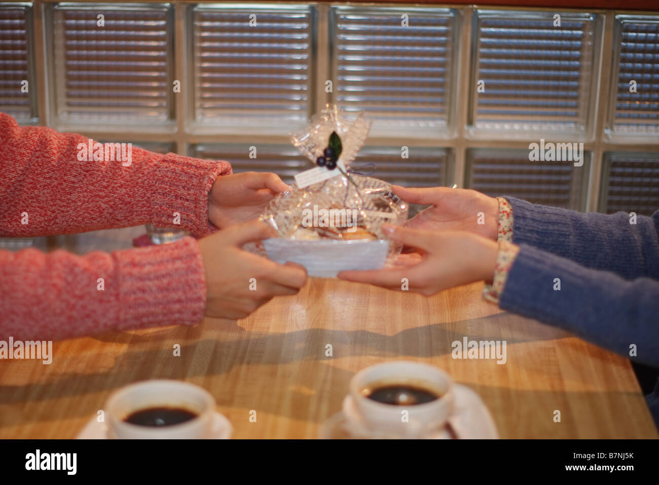 Giving a present Stock Photo - Alamy