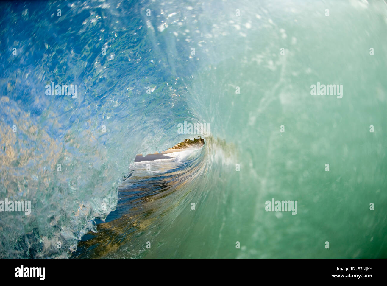 Inside a breaking wave at the beach. Zuma beach, California USA Stock ...