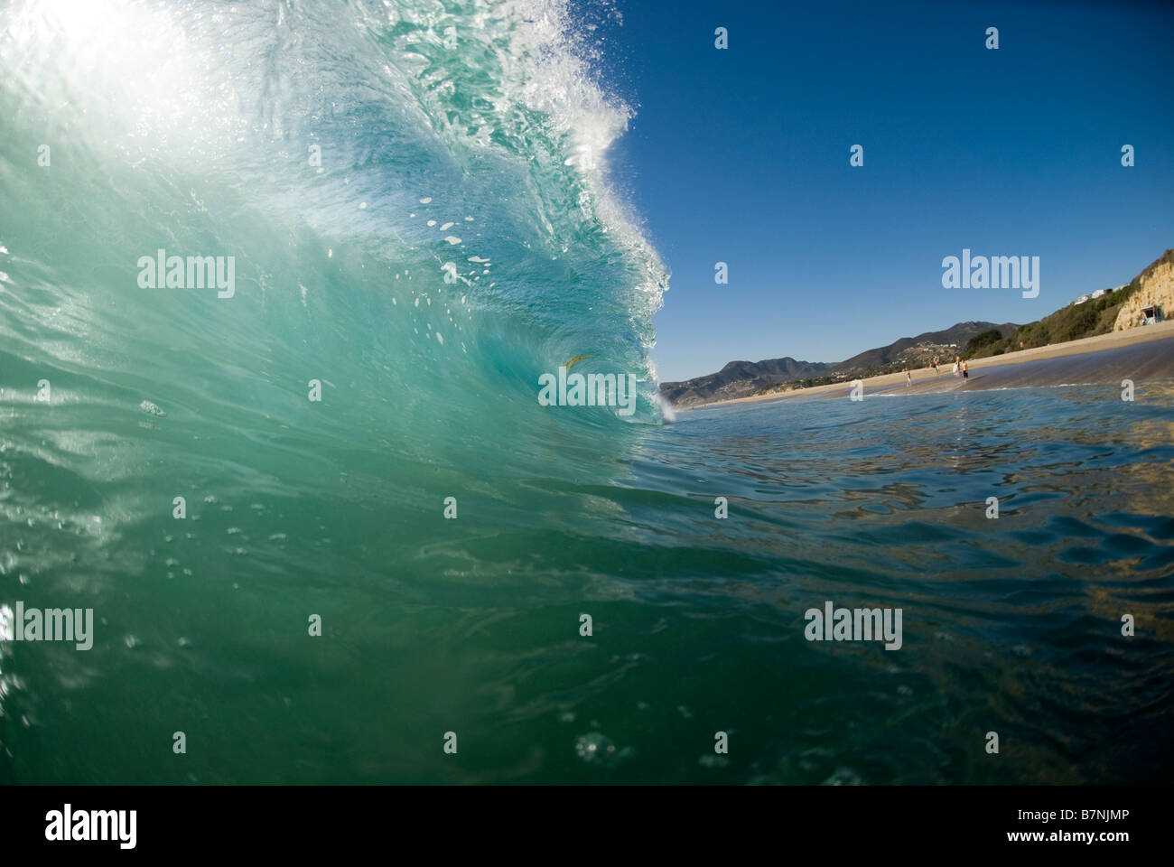 Inside a breaking wave at the beach. Zuma beach, California USA Stock ...