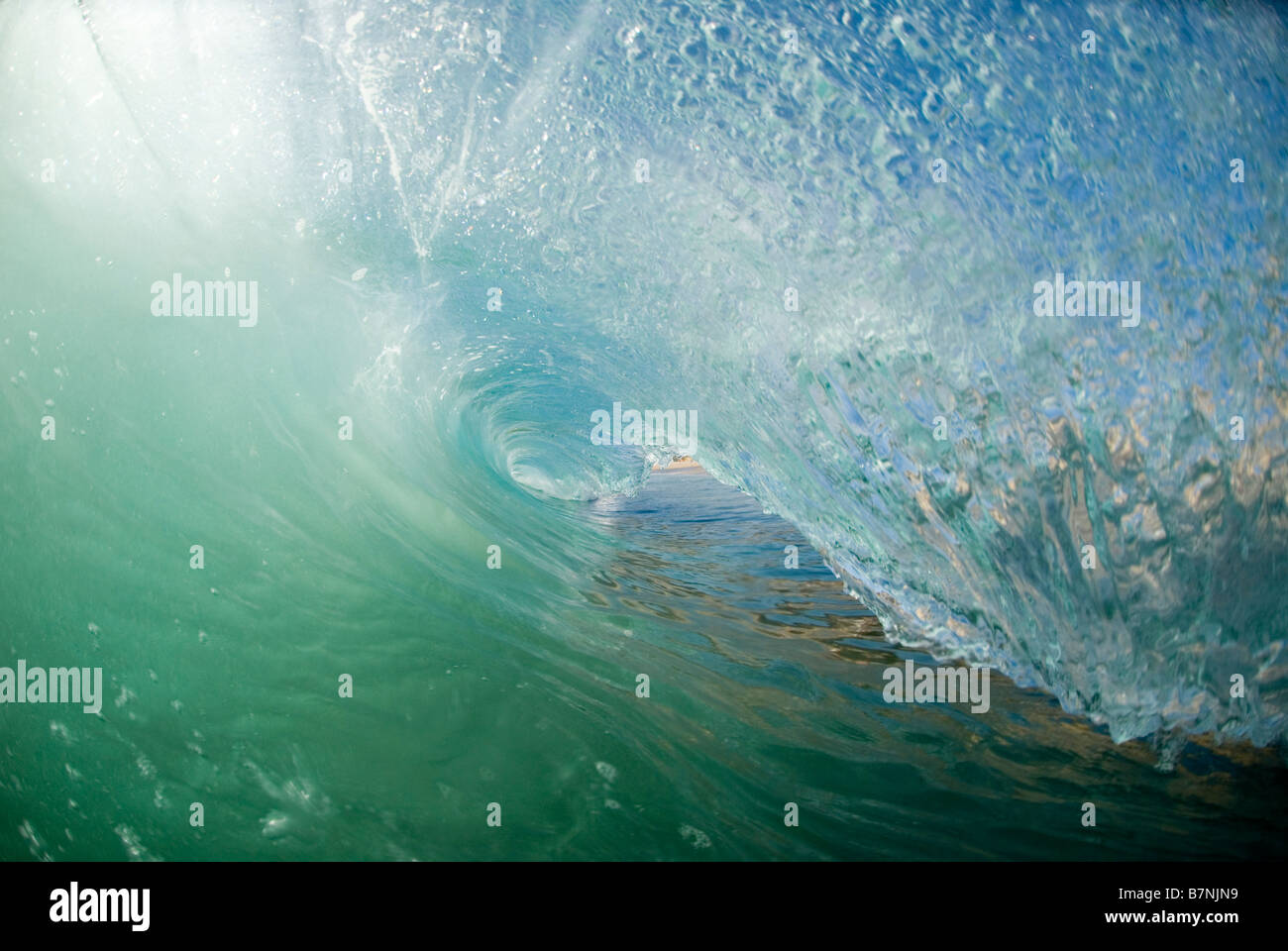 Inside a breaking wave at the beach. Zuma beach, California USA Stock ...