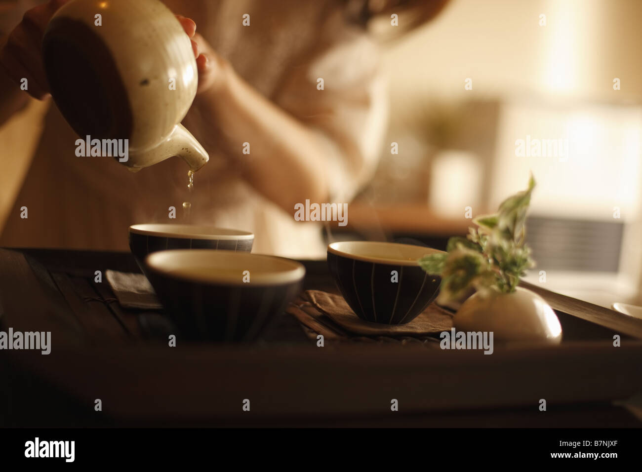 A woman making a cup of tea Stock Photo - Alamy