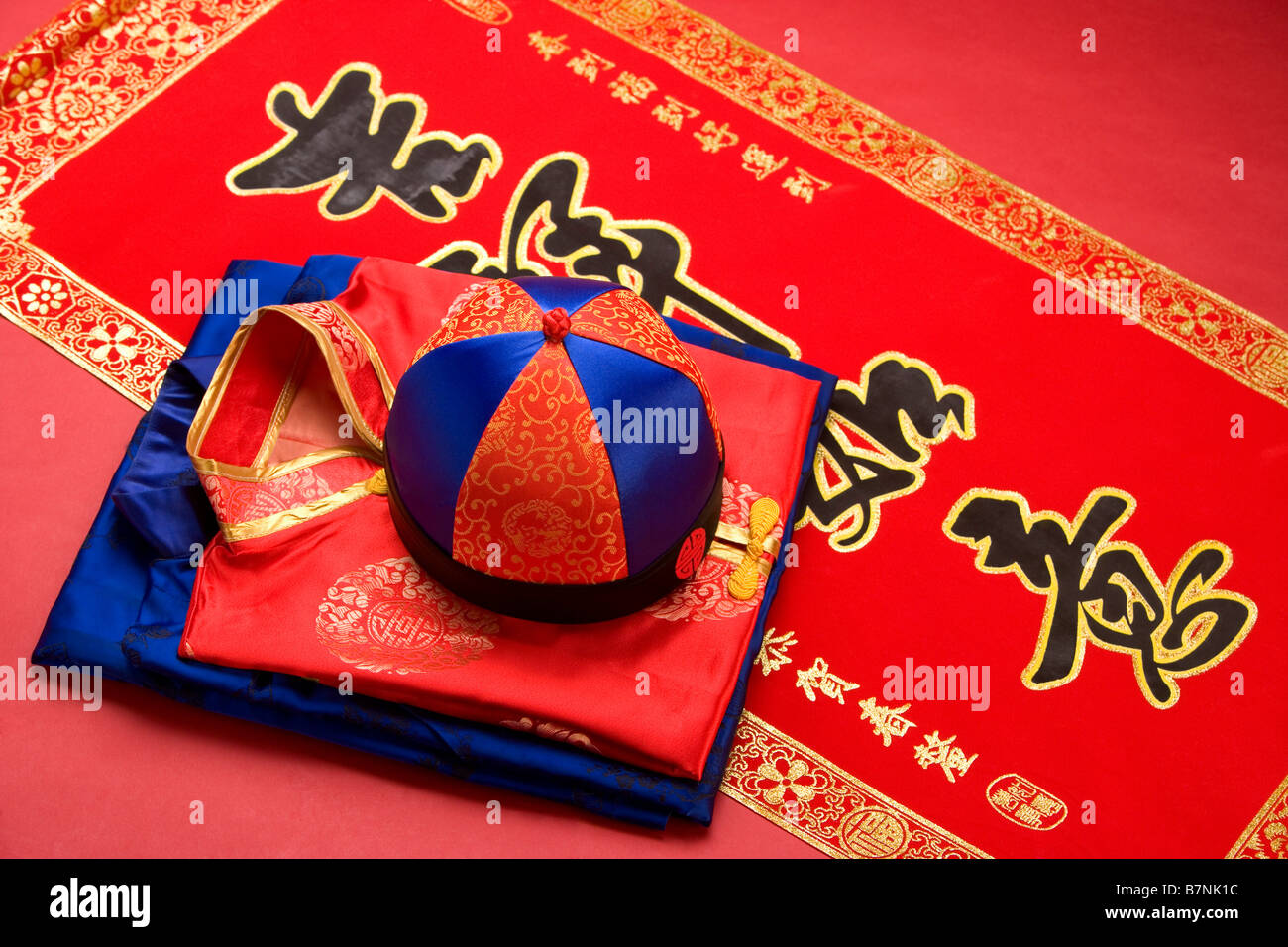Chinese traditional cap and clothes on couplet Stock Photo - Alamy