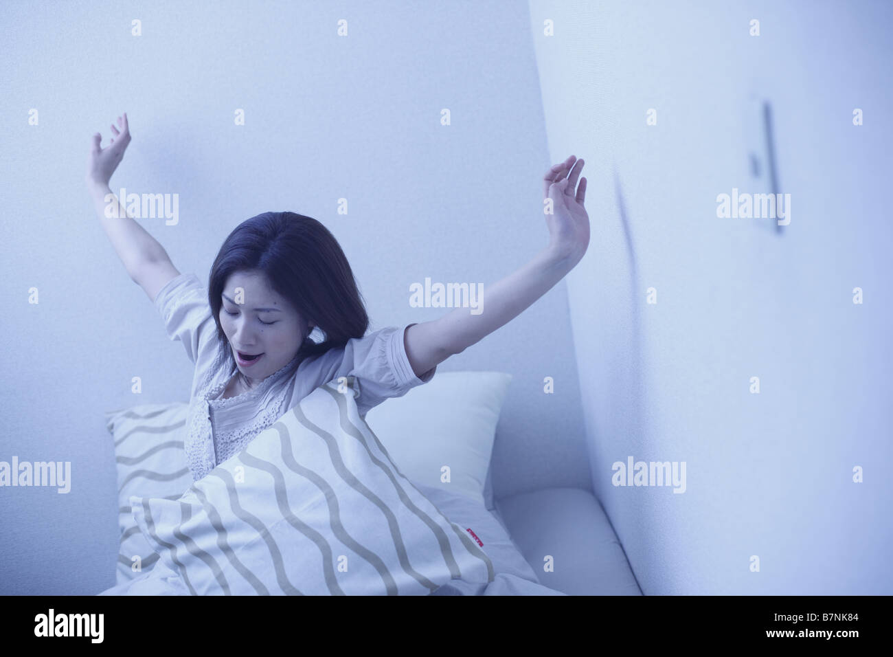 A woman getting up Stock Photo - Alamy