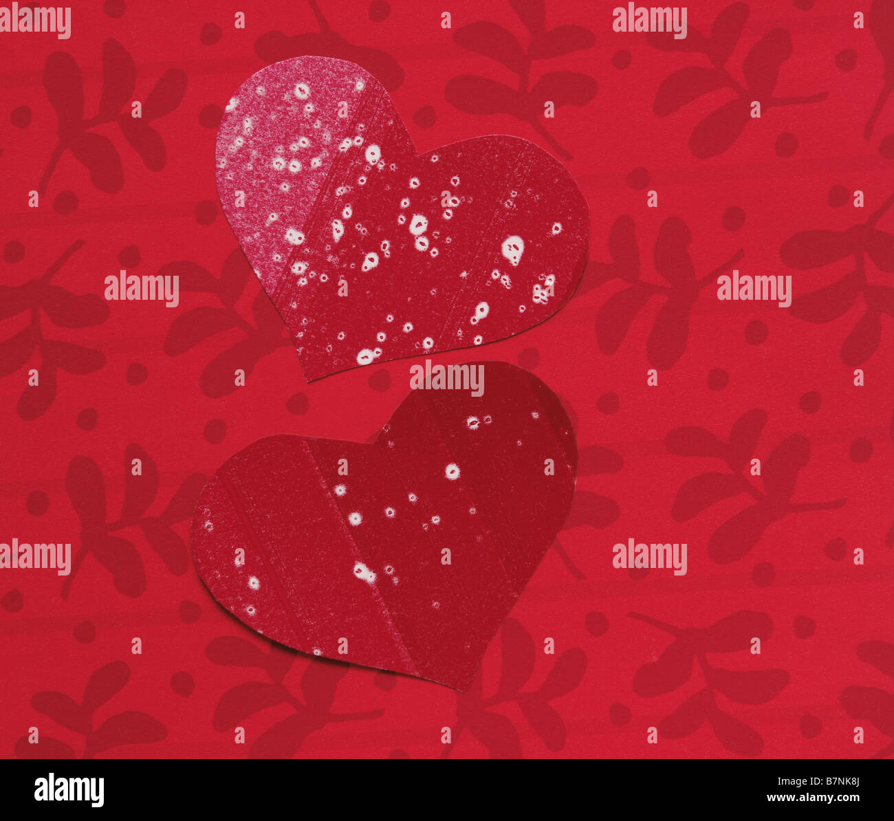 spotty red and white hearts on a background in two shades of red Stock ...