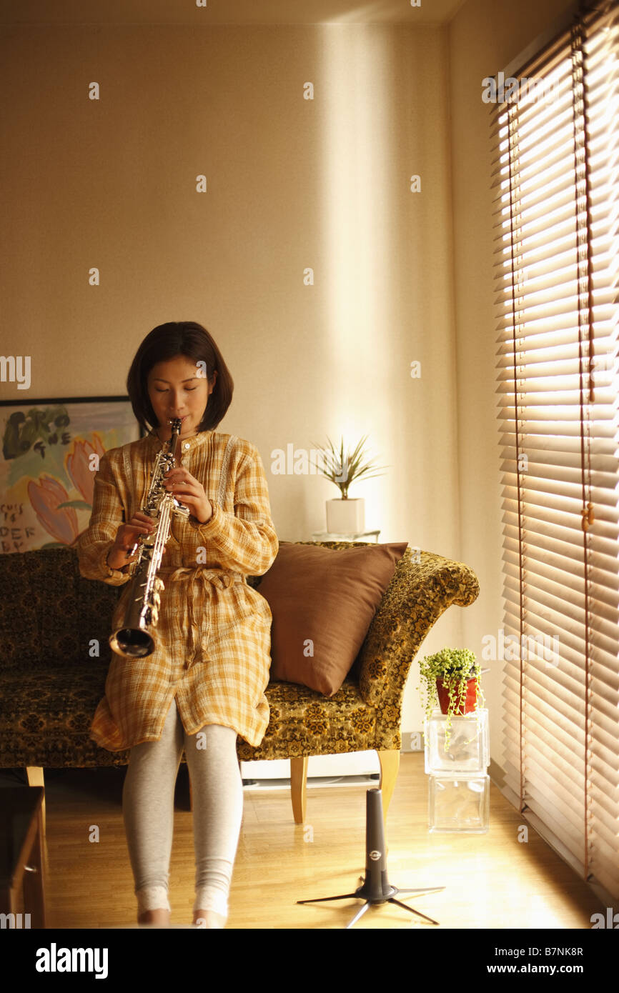 Playing soprano saxophone hi-res stock photography and images - Alamy