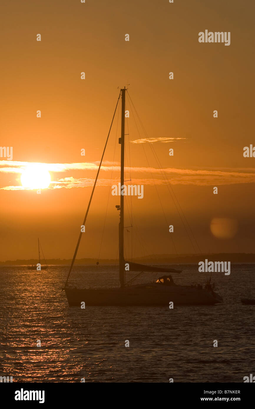 Boat at sunset Stock Photo - Alamy