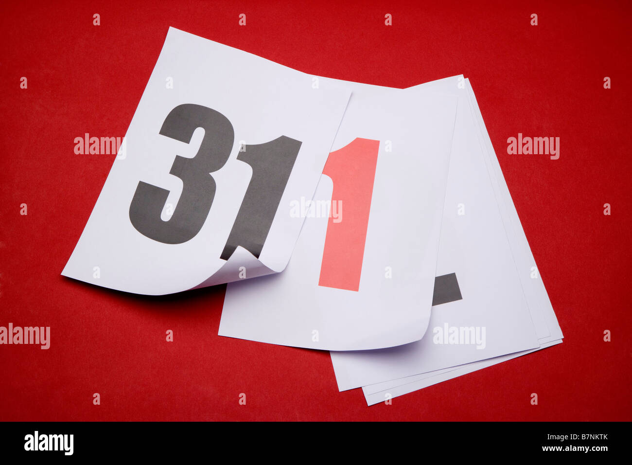 Calendar papers with red background Stock Photo - Alamy