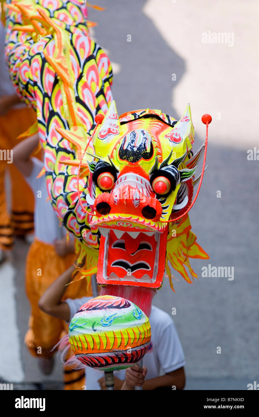 Chinese dragon and handlers Stock Photo - Alamy
