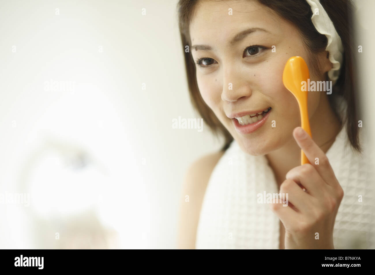 A woman caring her face Stock Photo - Alamy