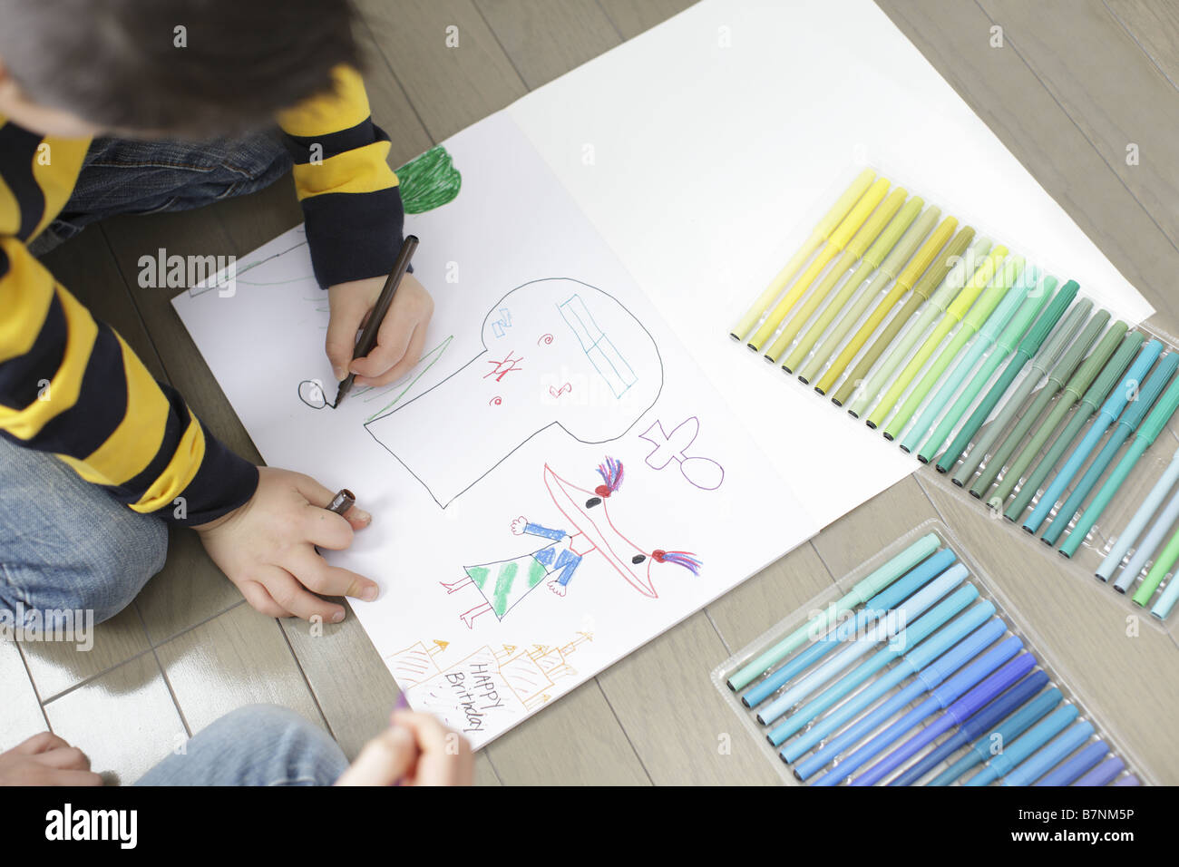 Children writing engrossed hi-res stock photography and images - Alamy