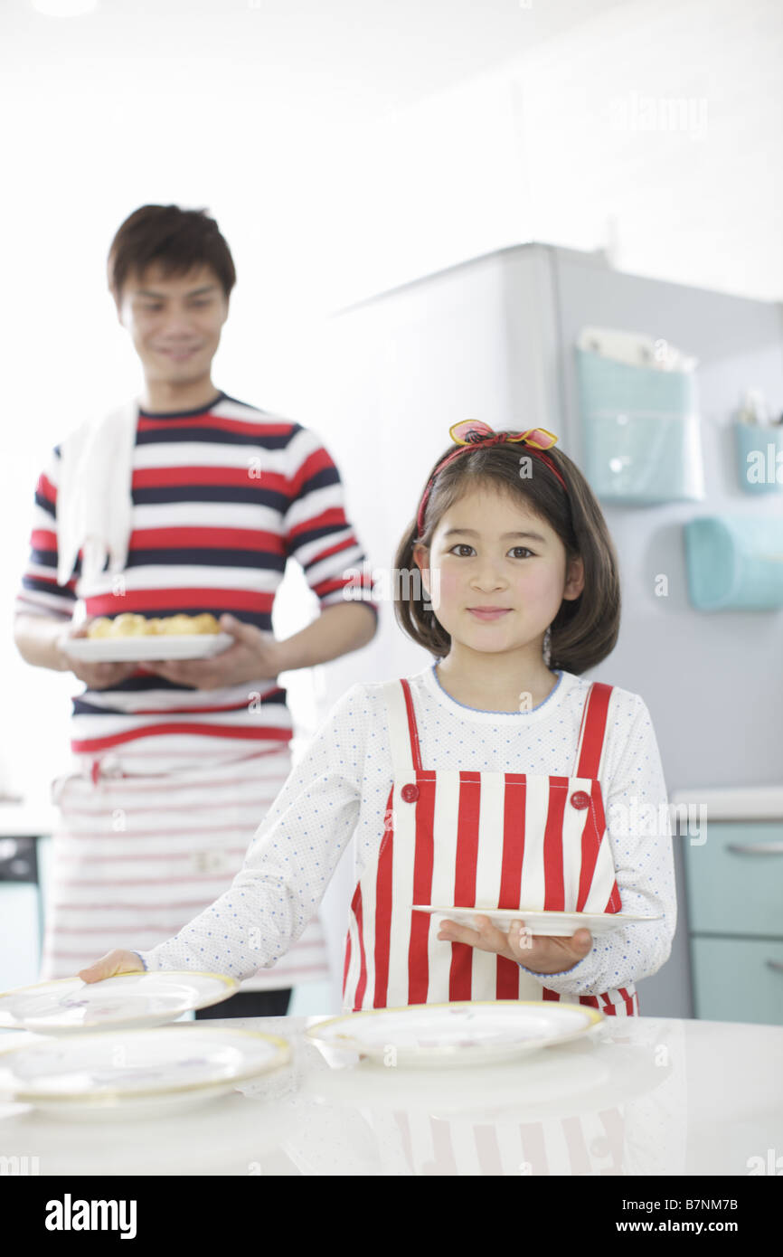 Father helping daughter cut hi-res stock photography and images - Alamy
