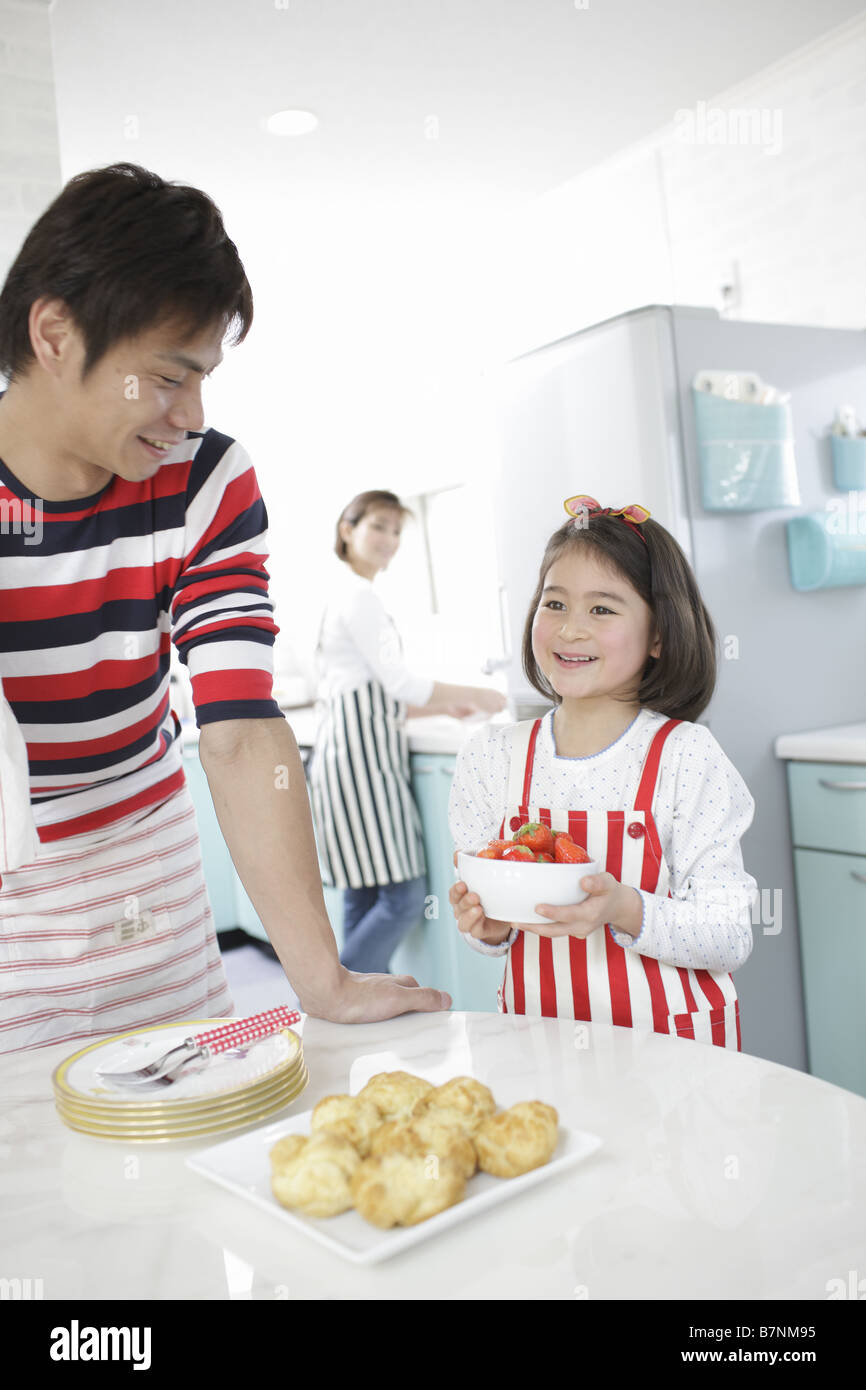 A girl helping parents Stock Photo - Alamy