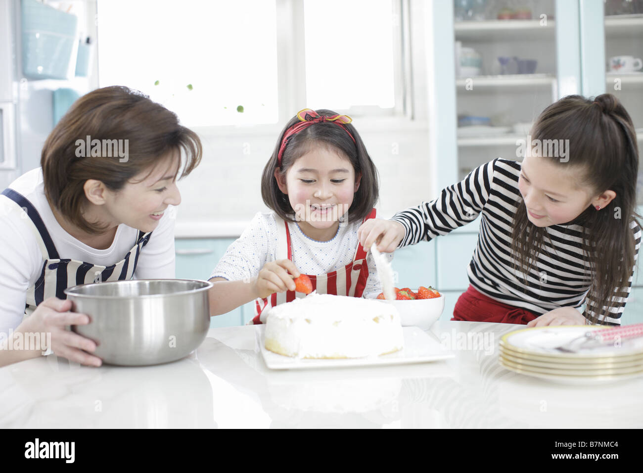 Family making sweets Stock Photo - Alamy