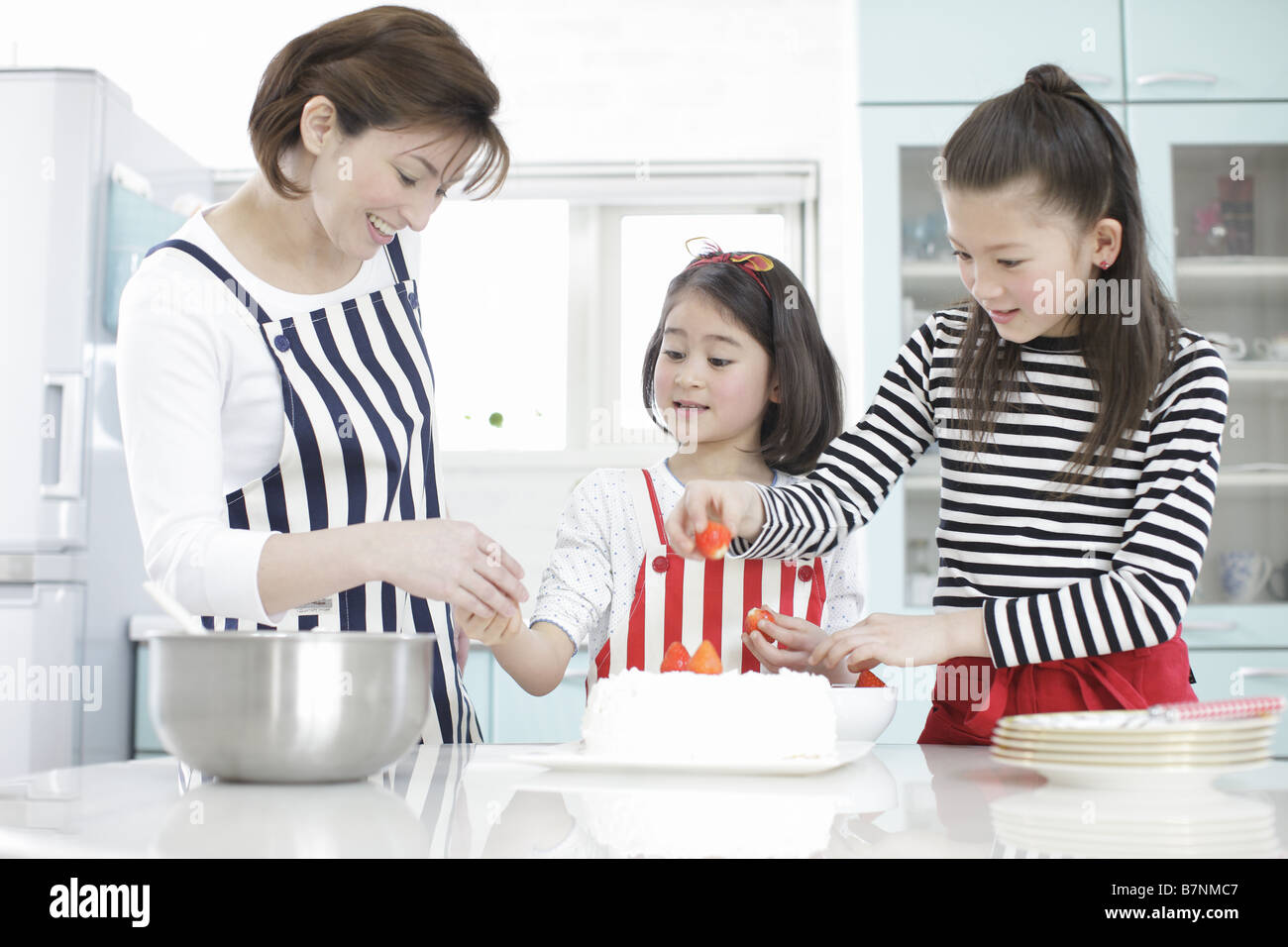 Family making sweets Stock Photo - Alamy