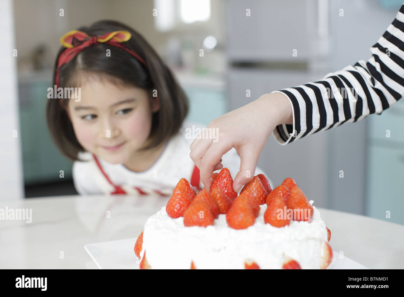 Child sneaking food hi-res stock photography and images - Alamy