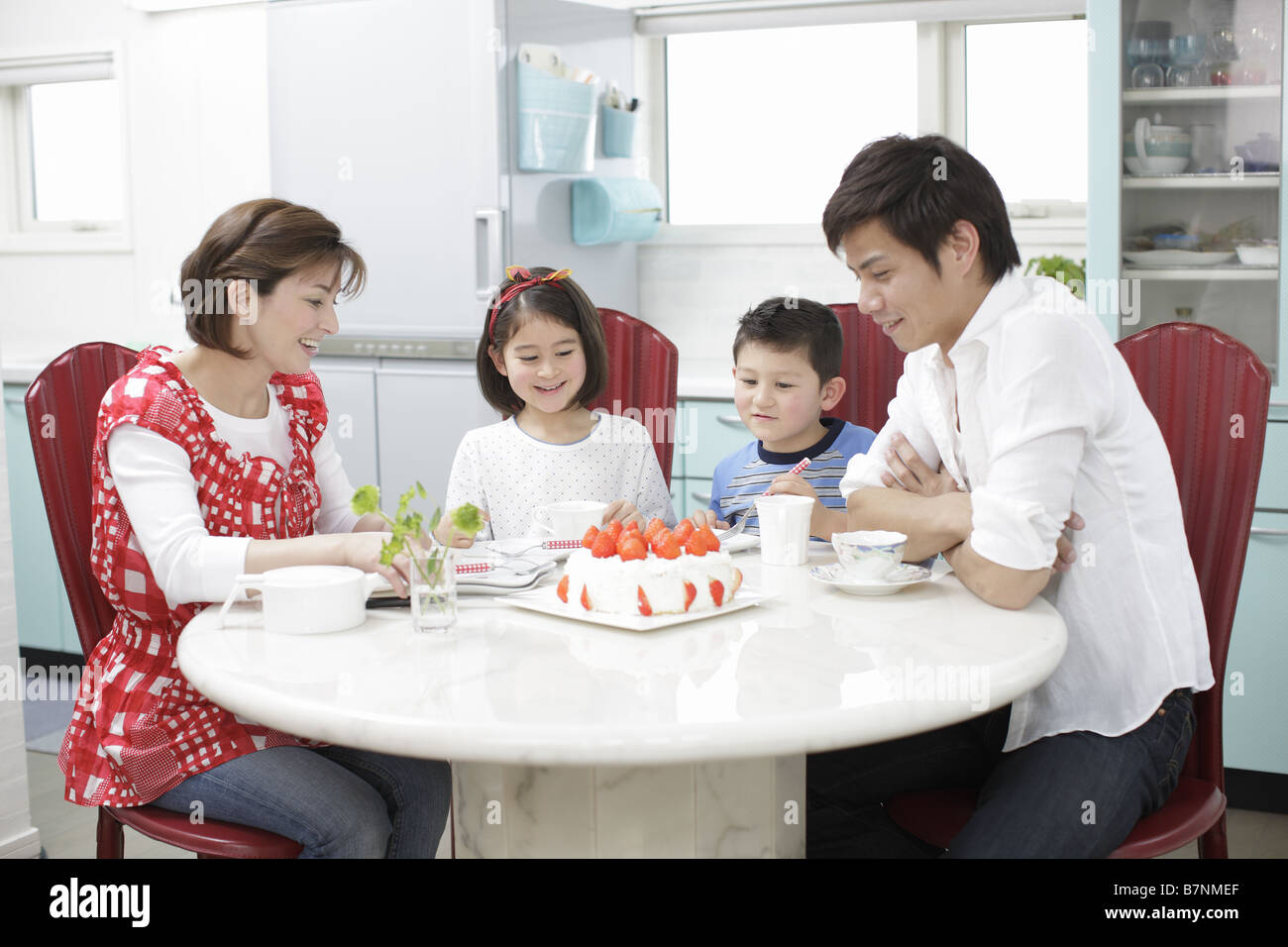 Family eating cake Stock Photo - Alamy