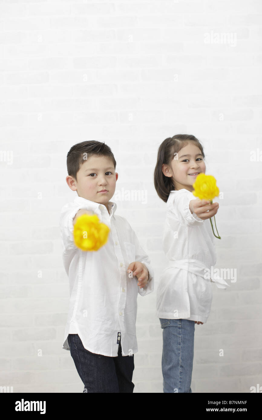 Children offering flowers Stock Photo - Alamy