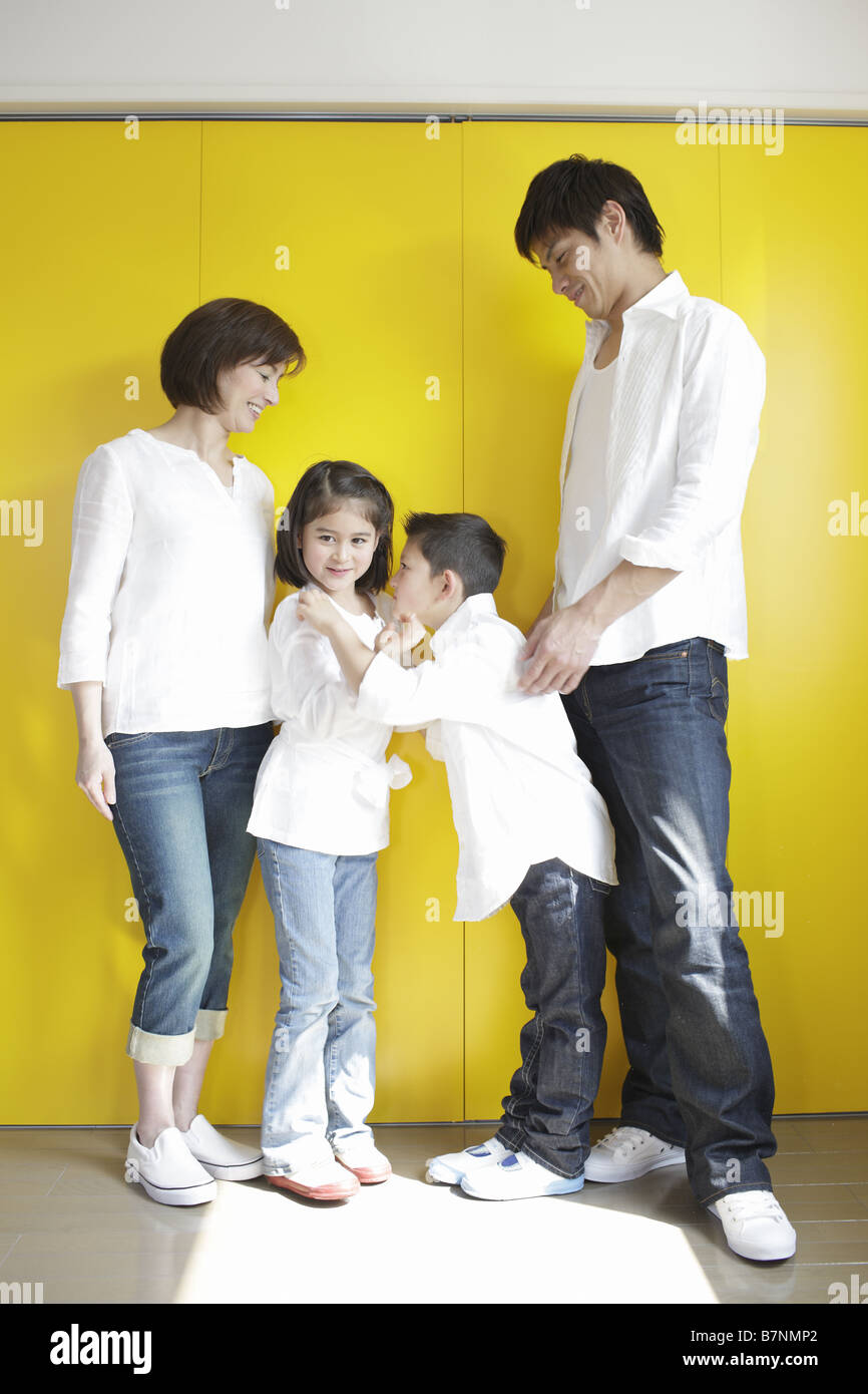 Family cuddling up Stock Photo - Alamy
