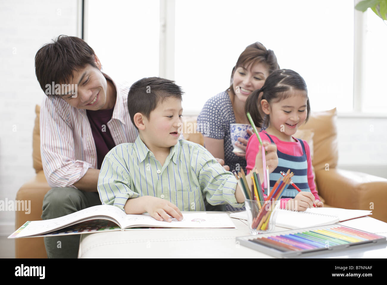 Family writing graffiti Stock Photo - Alamy