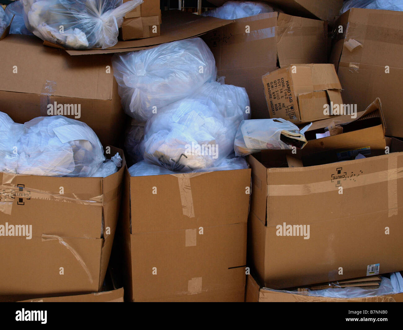 Recycling and garbage stacks piled on the side of the street in the ...