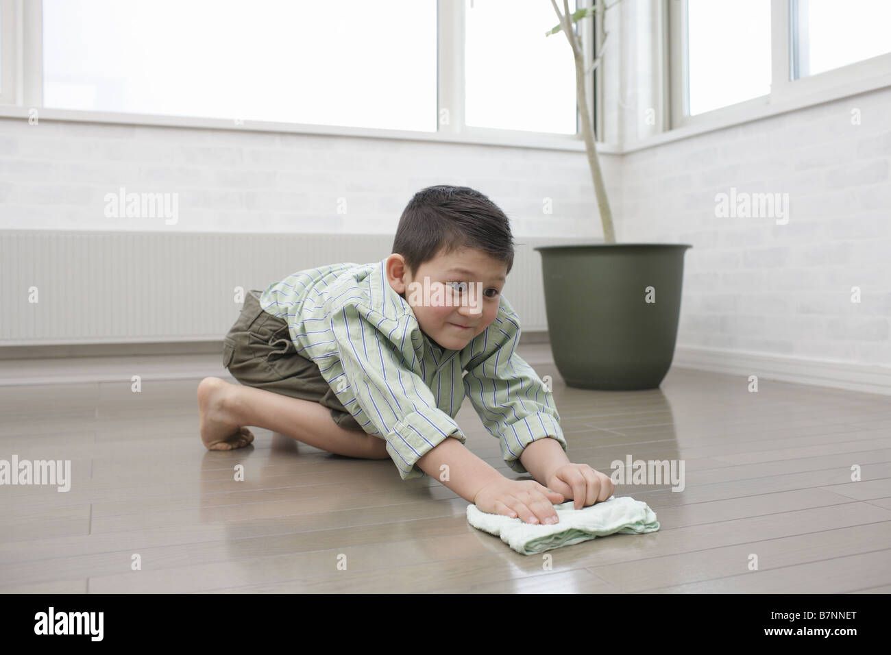 A boy cleaning up Stock Photo - Alamy