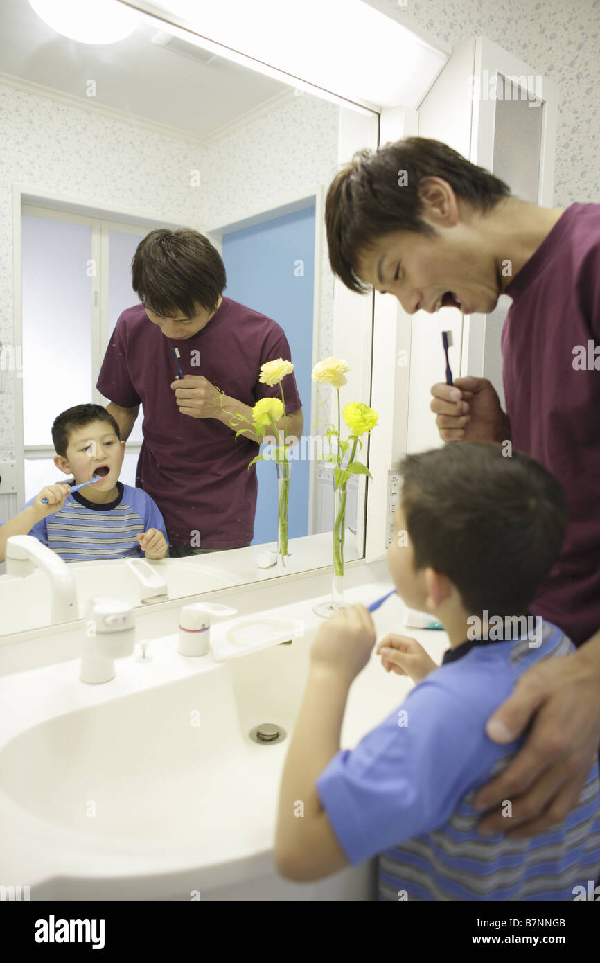 Father and son brushing teeth Stock Photo - Alamy