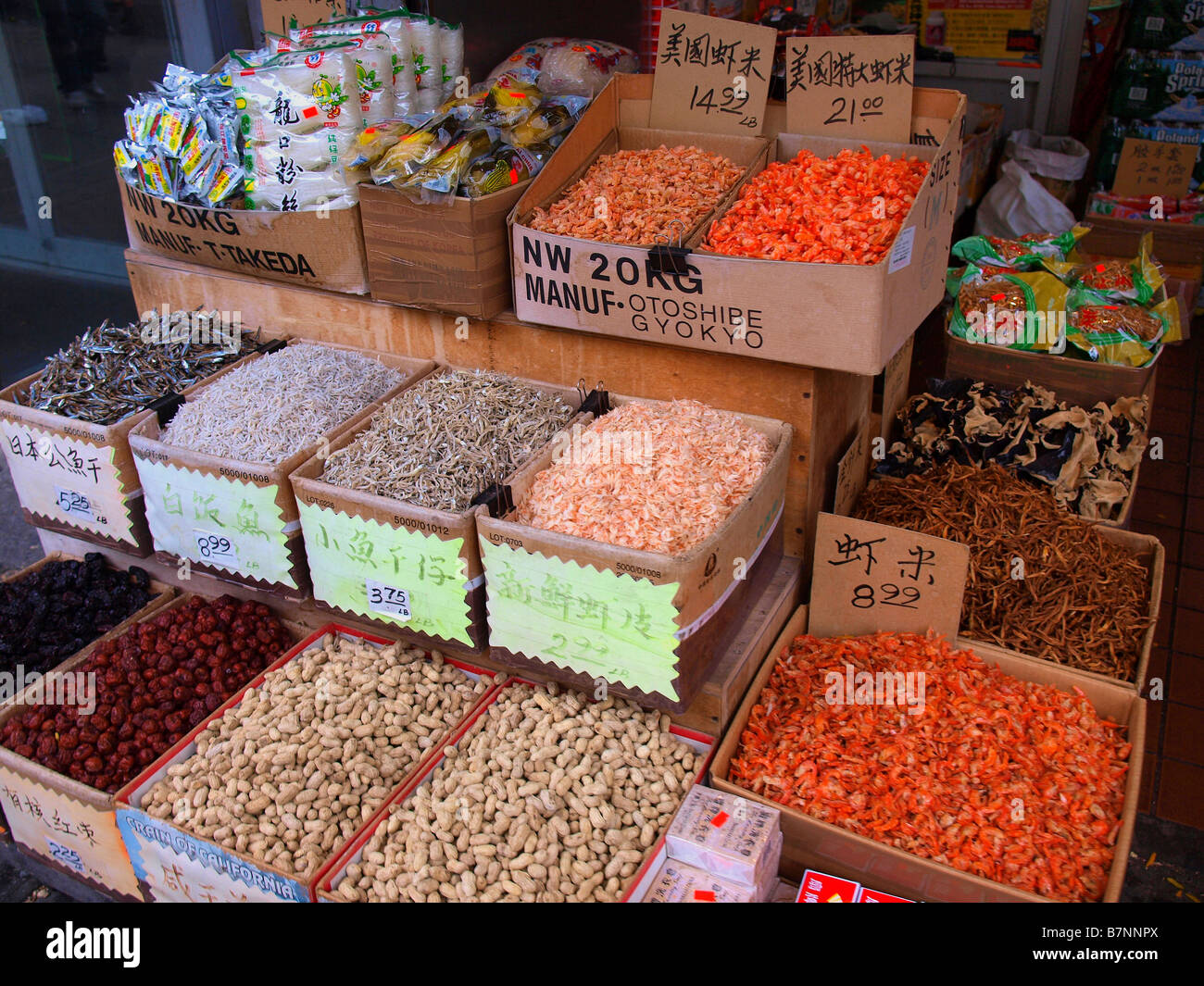 Dried goods in display boxes in front of a small grocery store in ...