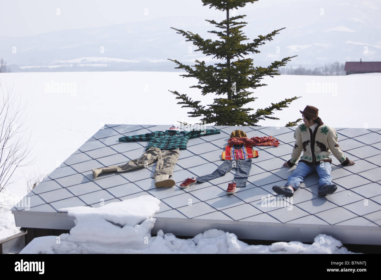 A man on the roof Stock Photo - Alamy