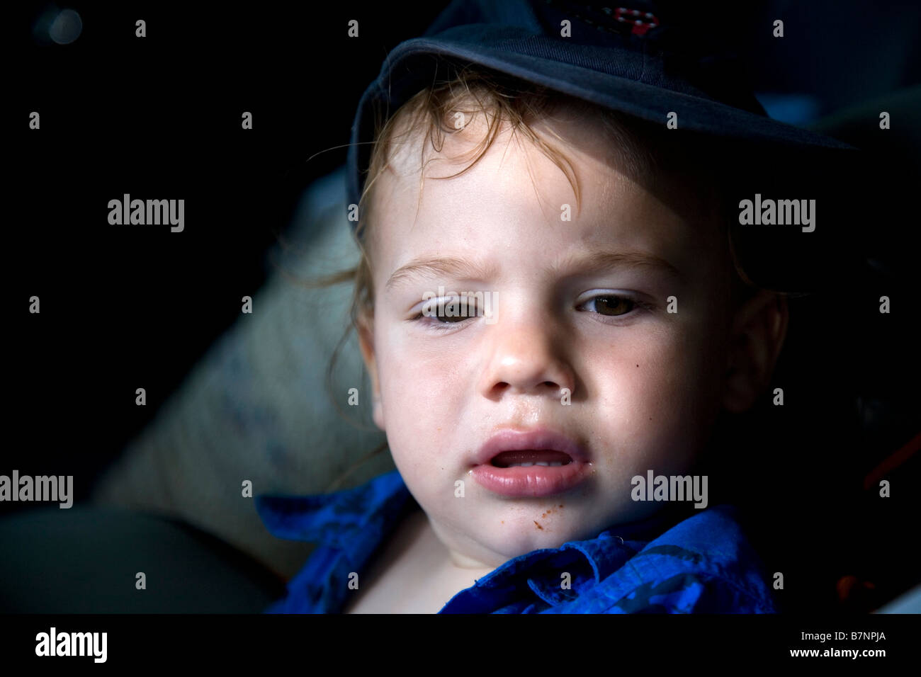 Portrait of tired boy Stock Photo - Alamy