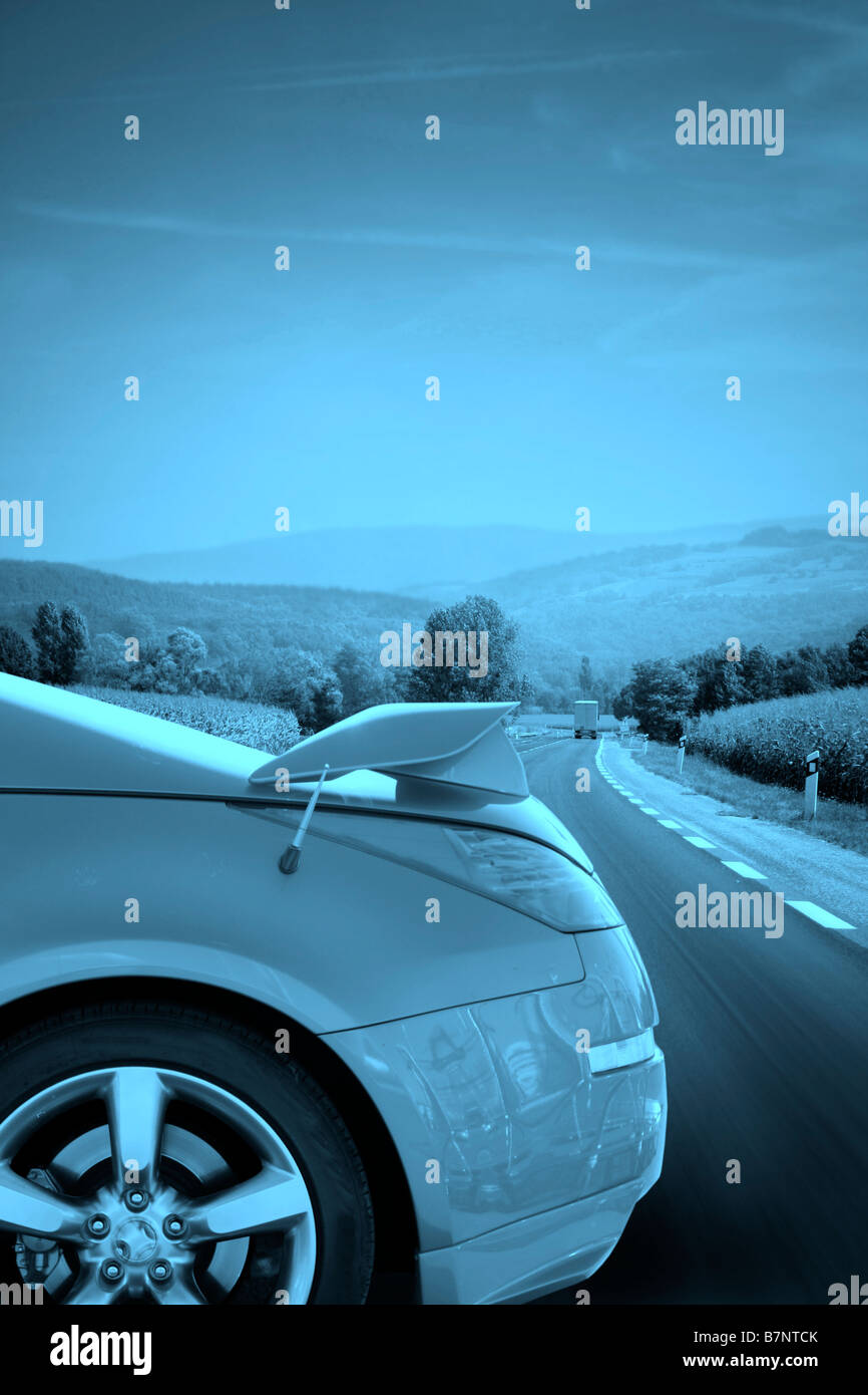 Car on the road view from the lateral Stock Photo - Alamy
