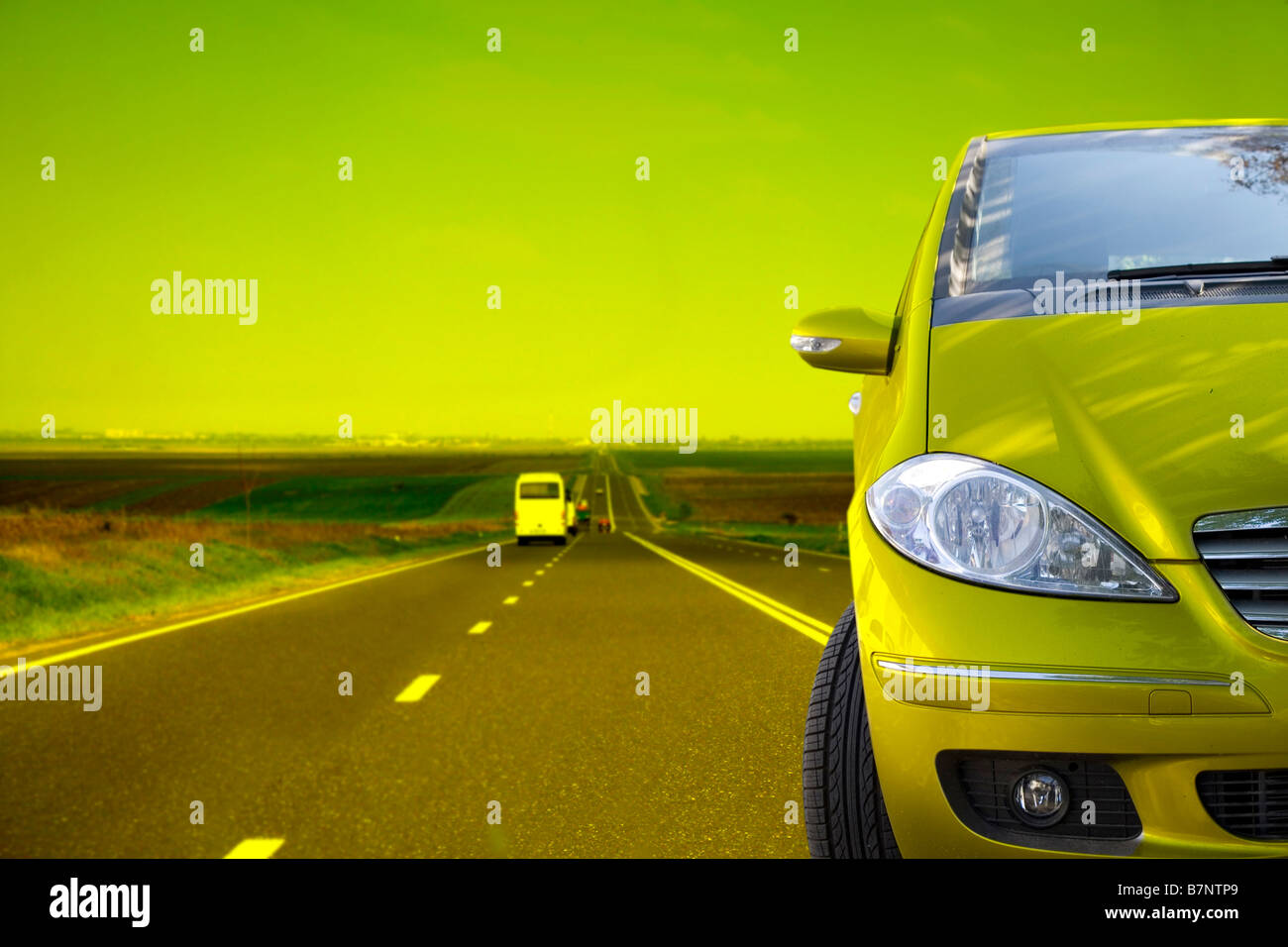 Yellow car on the road Stock Photo - Alamy