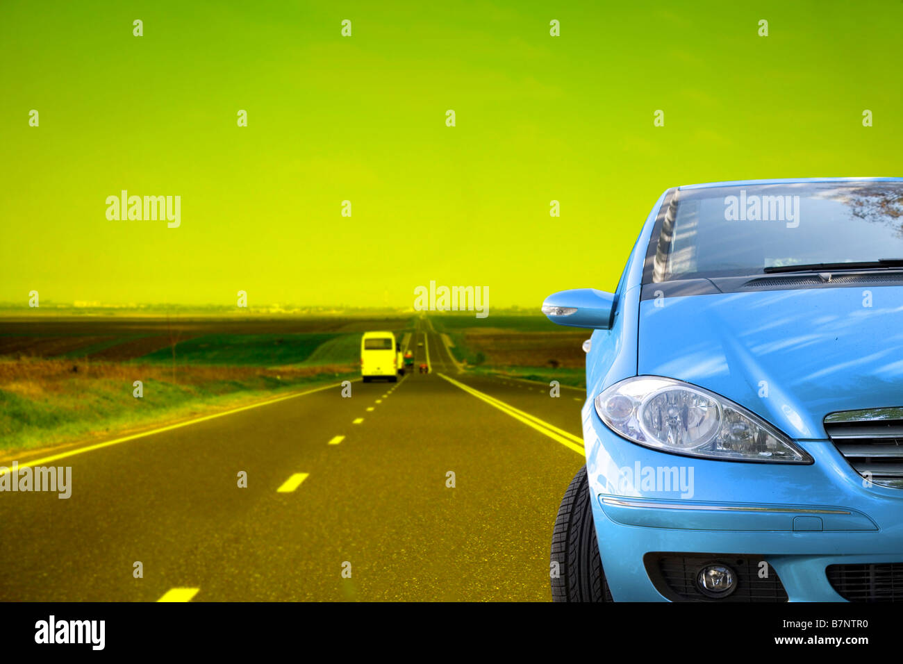 Blue car on the road Stock Photo - Alamy