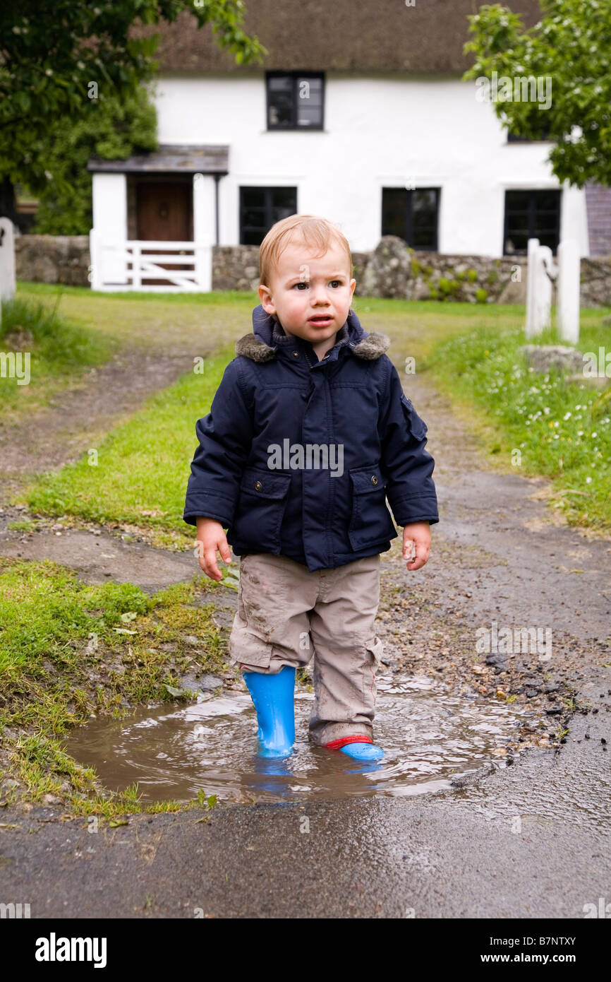 Puddle in country lane hi-res stock photography and images - Alamy