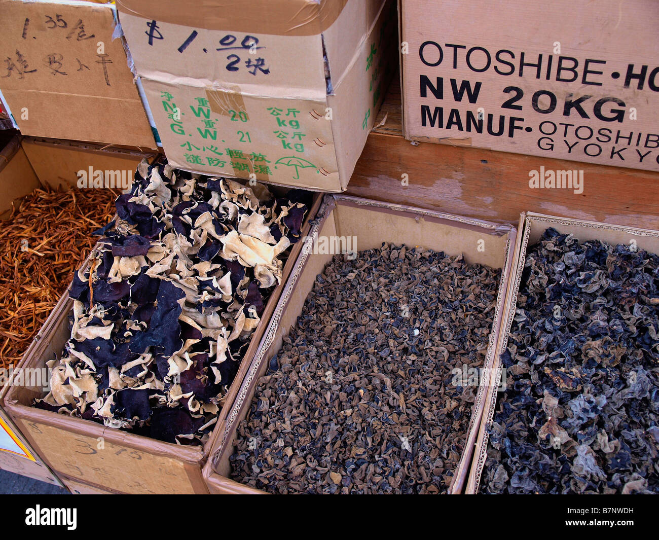Dried goods in display boxes in front of a small grocery store in ...