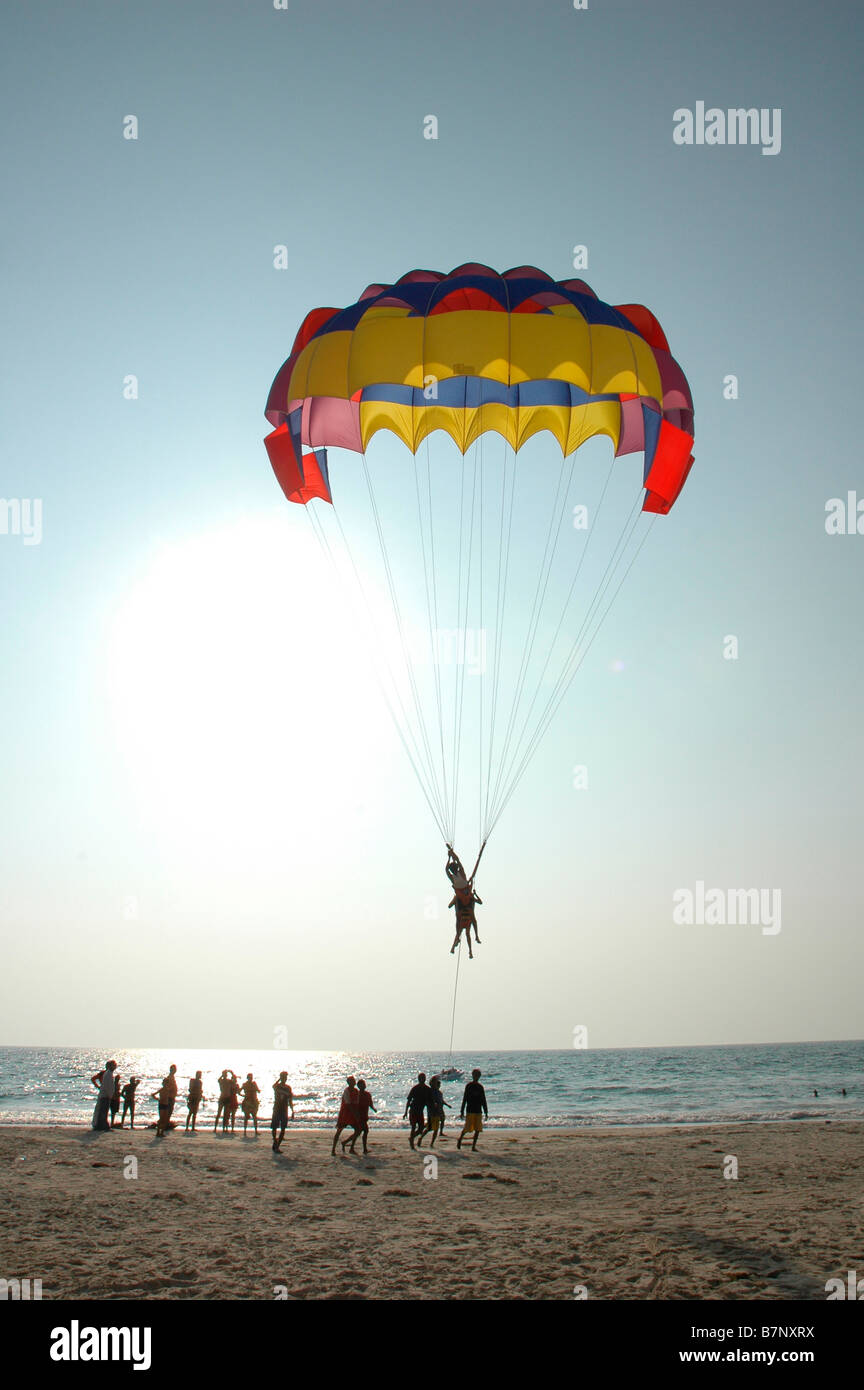 Parascending on a beach in Goa India Stock Photo - Alamy