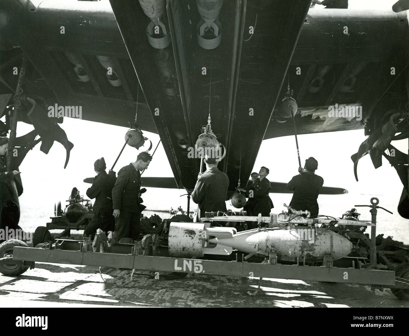 SHORT STIRLING An RAF armament crew load 500lb bombs into the huge bay ...
