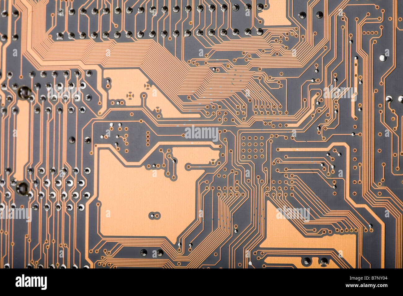 Close up of a section of the back of a computer motherboard circuit ...