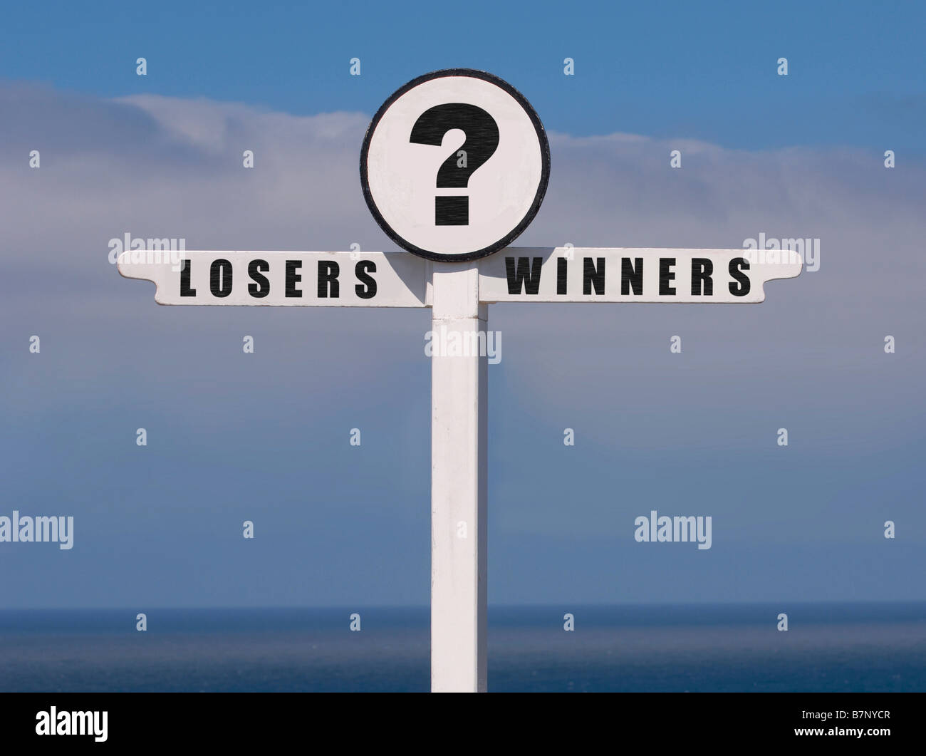 White signpost with Winners and Losers signs in opposite directions ...