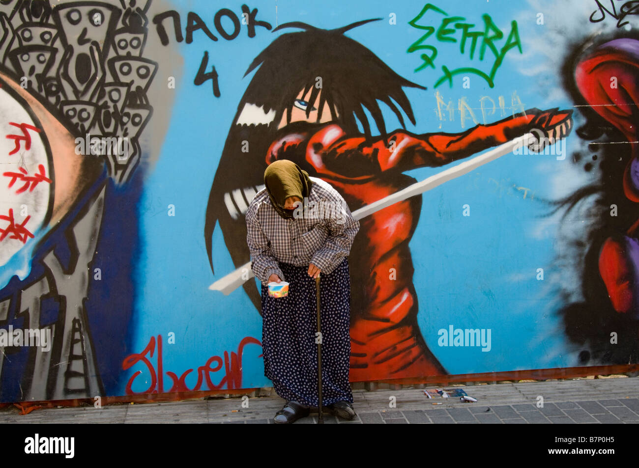 Heraklion / Irakleo, Crete, Greece. Old woman begging in front of ...