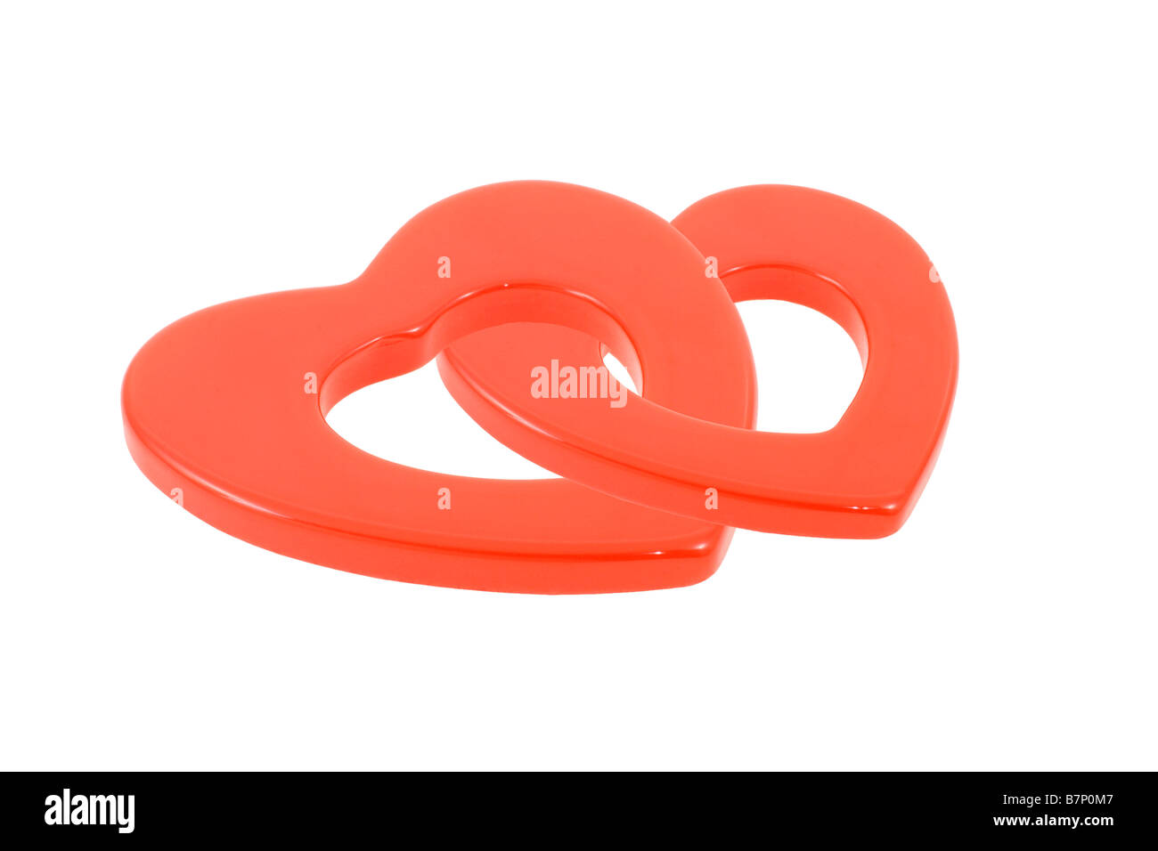 Interlocking love heart shape ornaments on white background Stock Photo ...