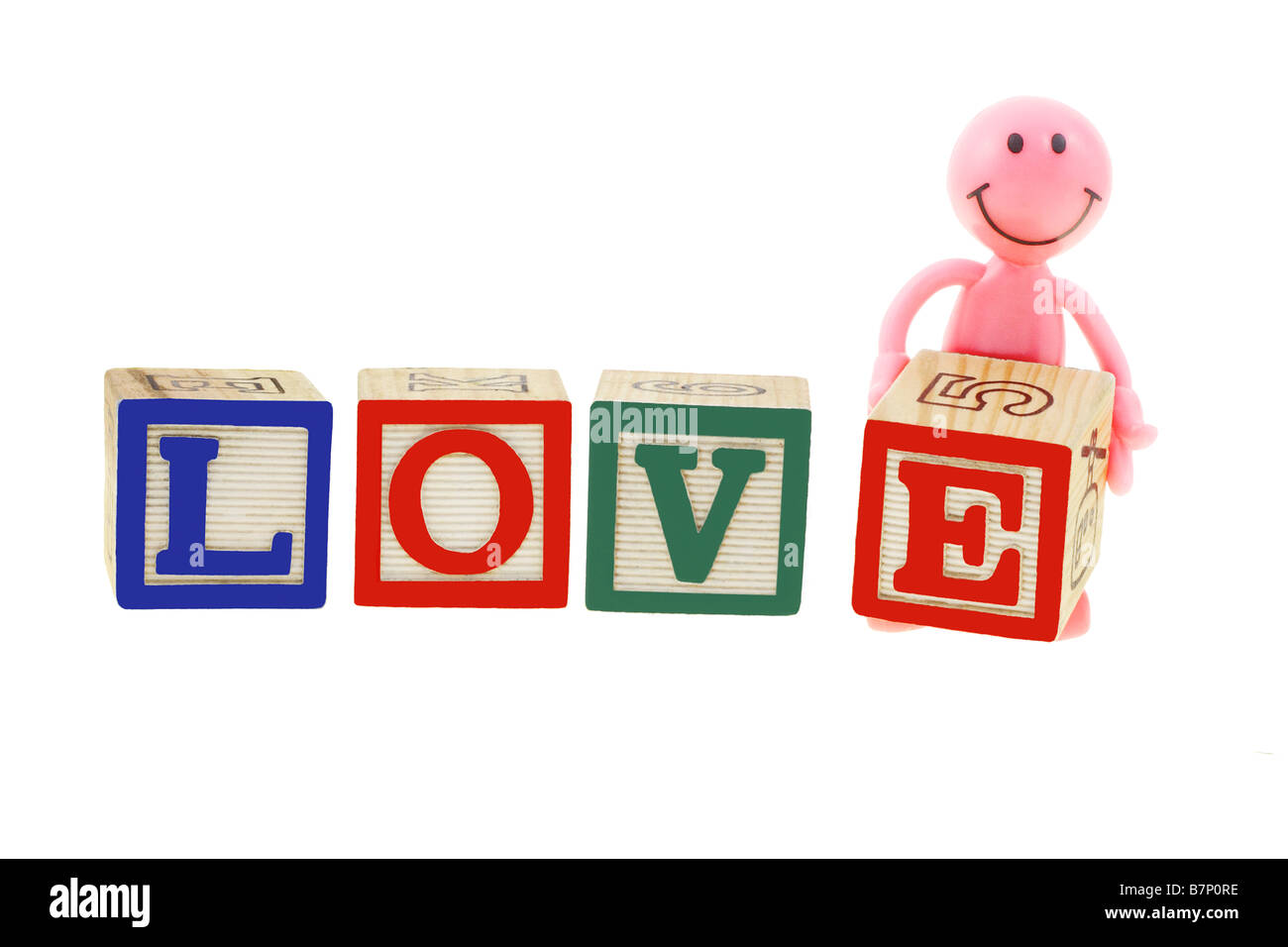 Smiley assembling alphabet blocks to form the word love Stock Photo - Alamy