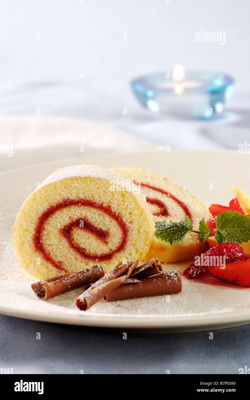 Two slices of strawberry jam Swiss roll Stock Photo - Alamy