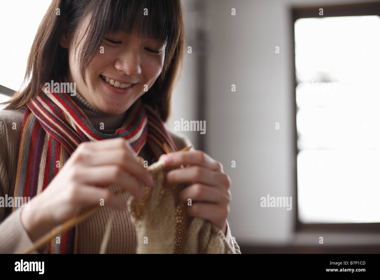 A woman knitting together Stock Photo - Alamy