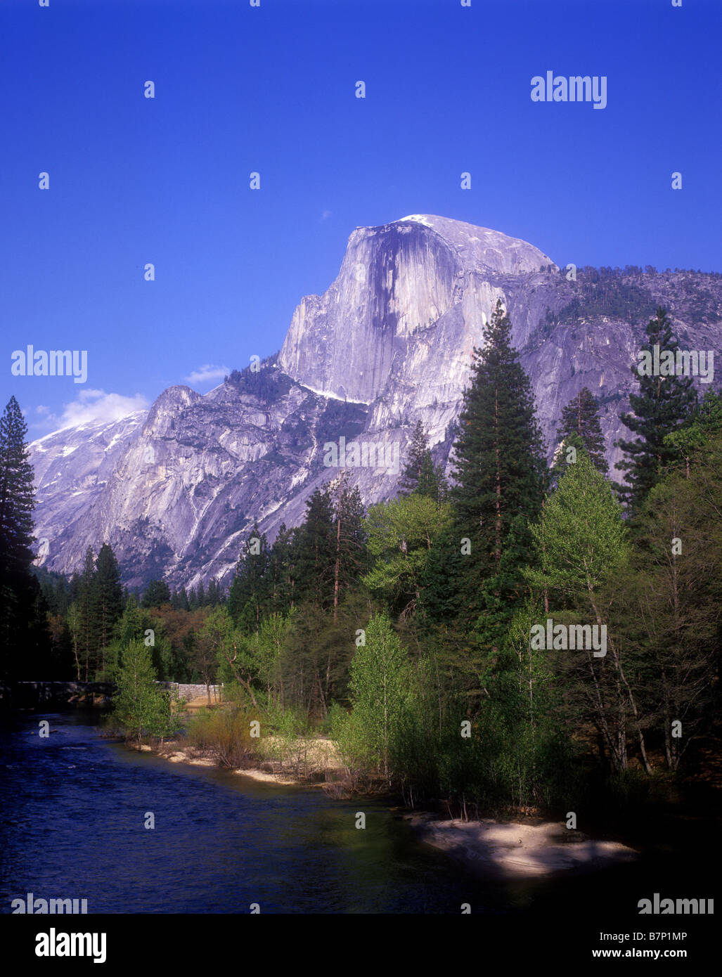The Merced River running through the beautiful scenery of Yosemite ...