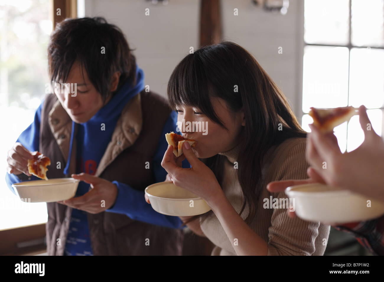 Young people having lunch Stock Photo - Alamy