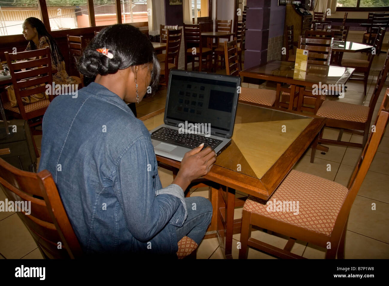 Woman using laptop computer Yaoundé Cameroon West Africa Stock Photo - Alamy