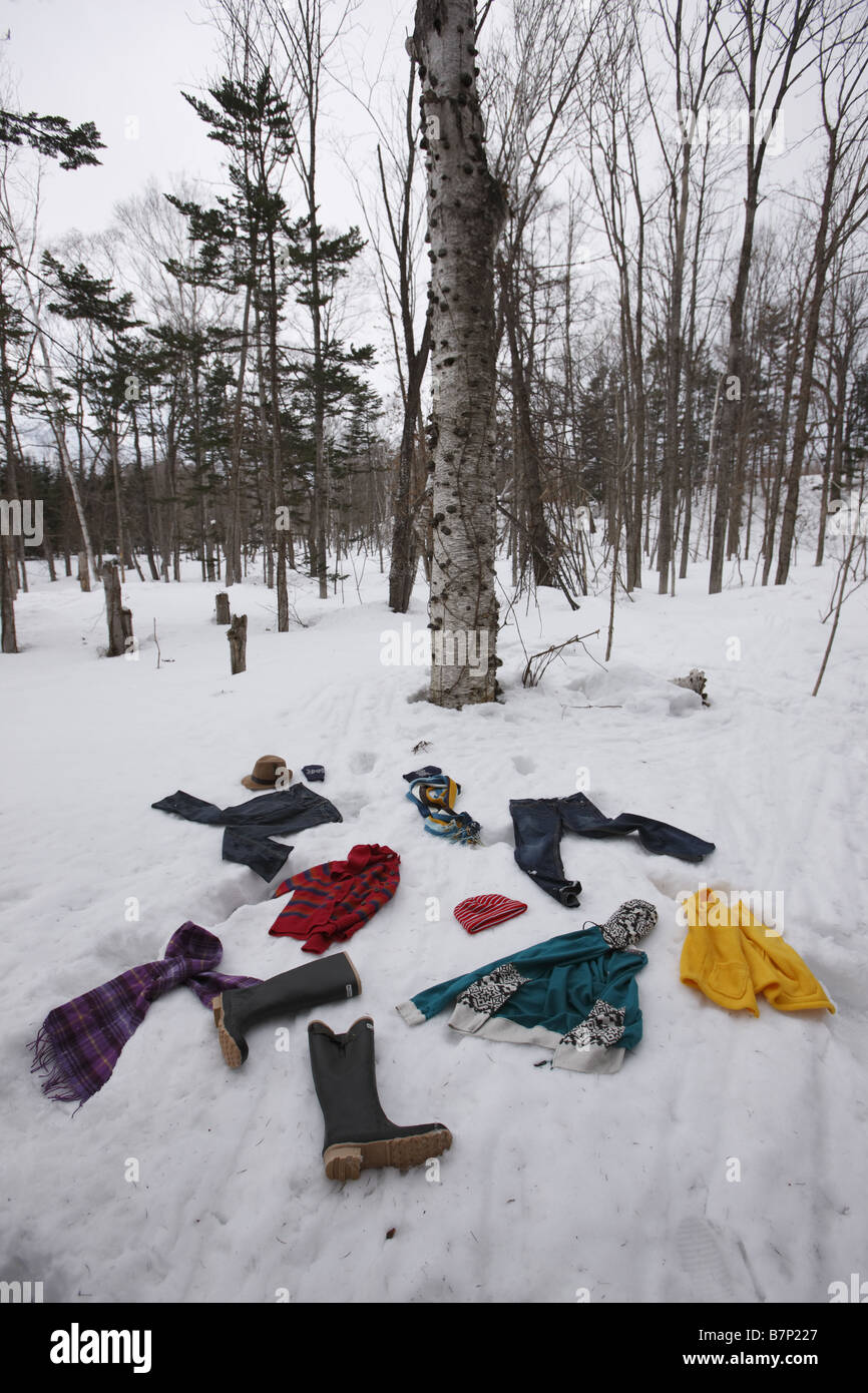 Clothes scattered on snow Stock Photo - Alamy