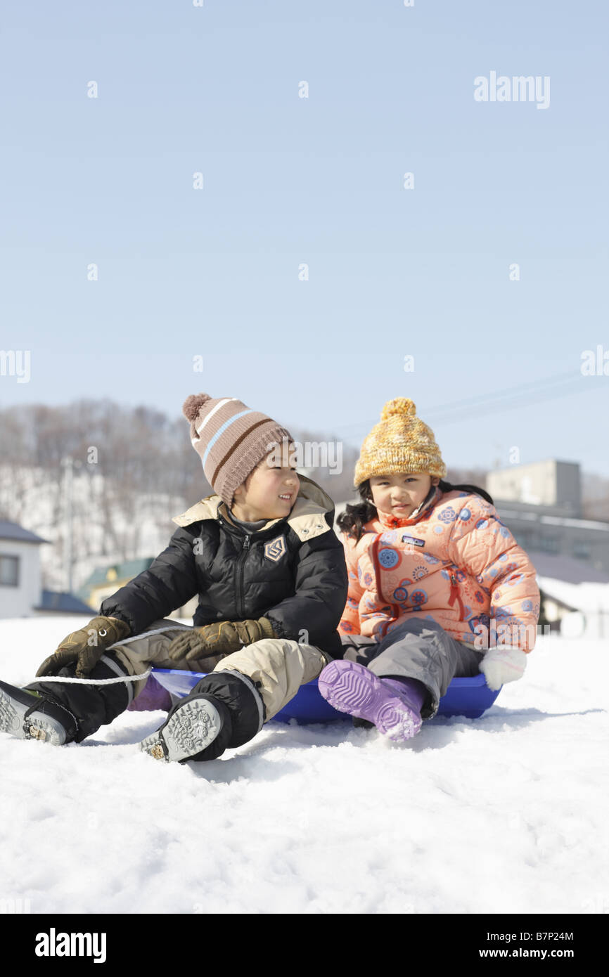 Children at play sledding Stock Photo - Alamy