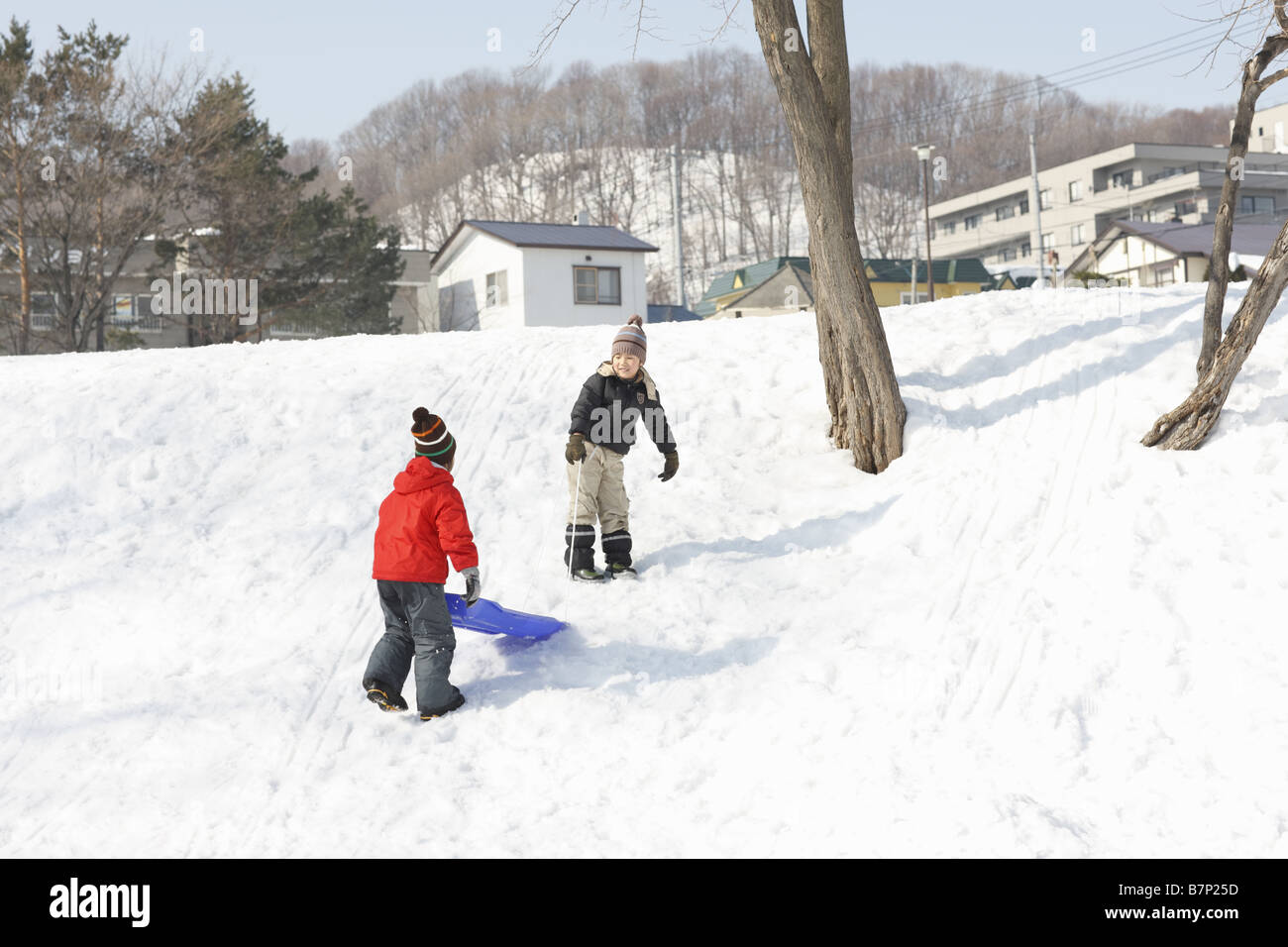 Children at play sledding Stock Photo - Alamy